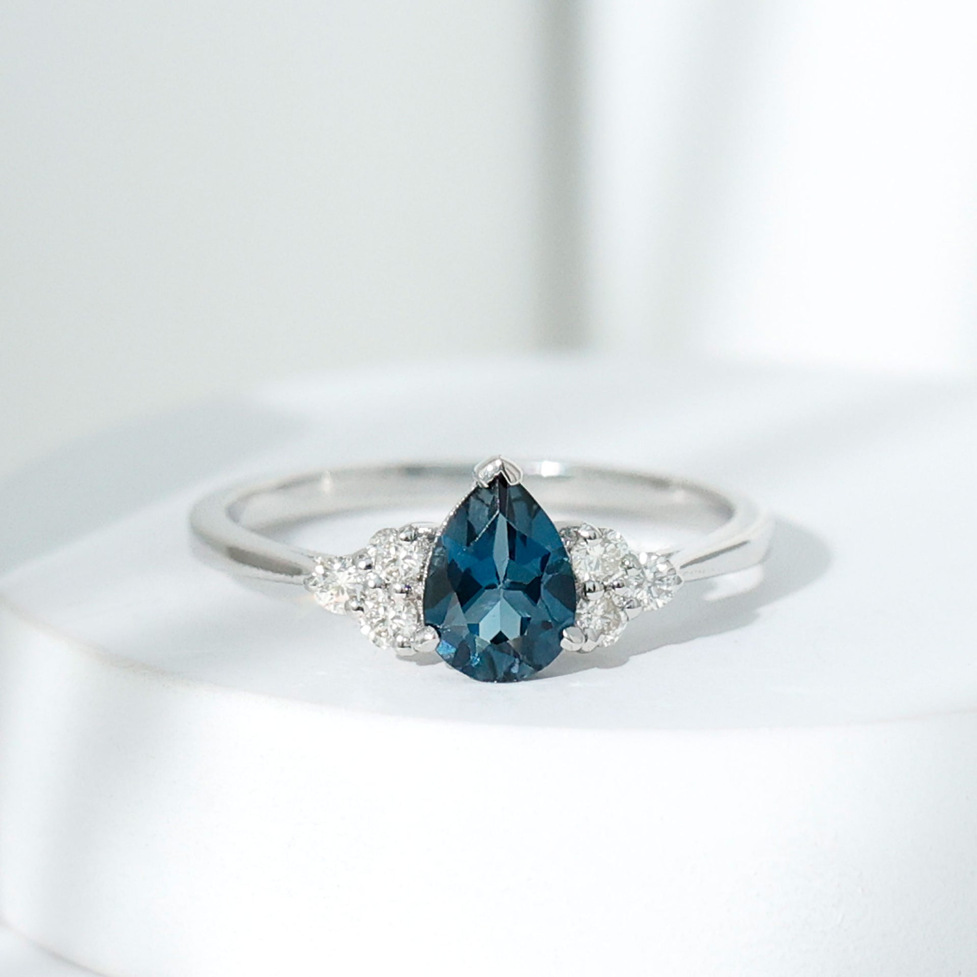 Pear Cut London Blue Topaz Engagement Ring with Diamond Trio – Rosec Jewels